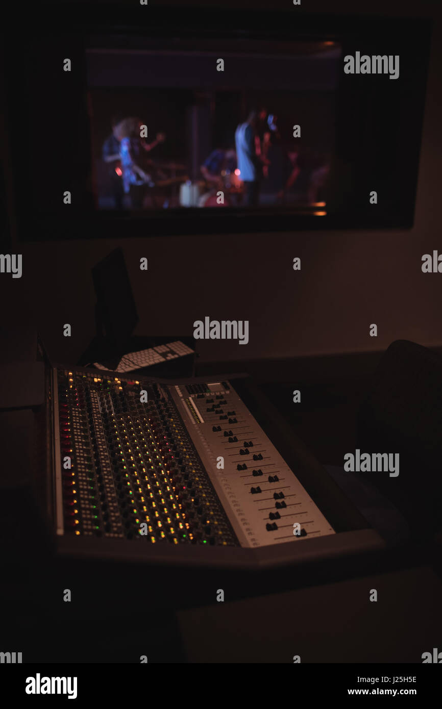 Rear view of band performing in recording studio Stock Photo - Alamy