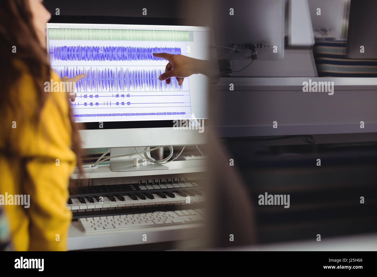 Two sound engineers working together in studio Stock Photo - Alamy
