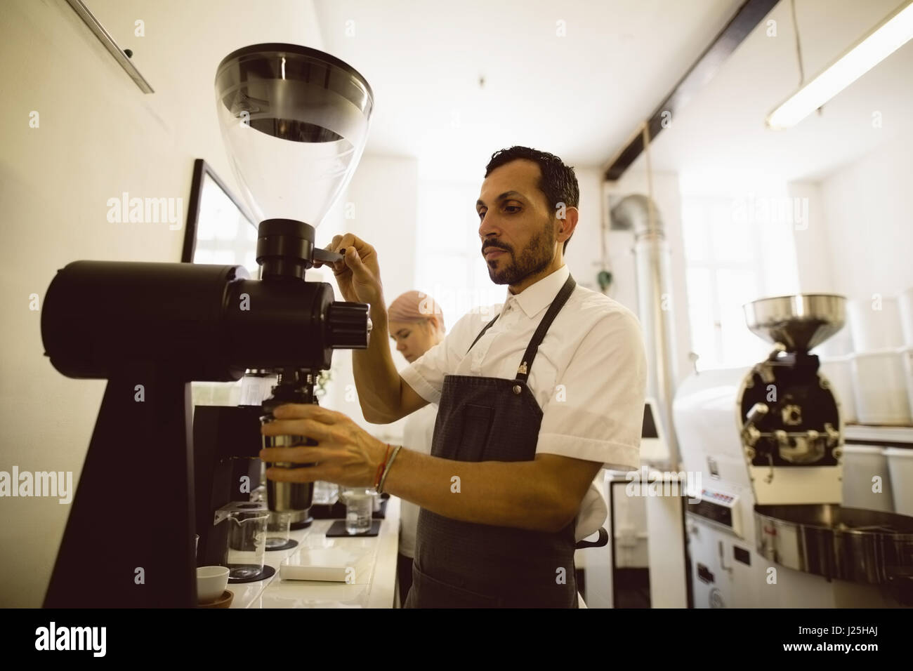 Barista preparing coffee in the coffee shop Stock Photo - Alamy