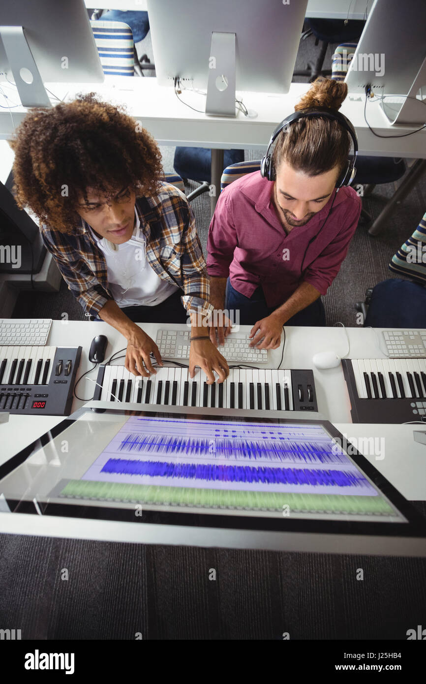 Top view of two sound engineers working together in studio Stock Photo ...