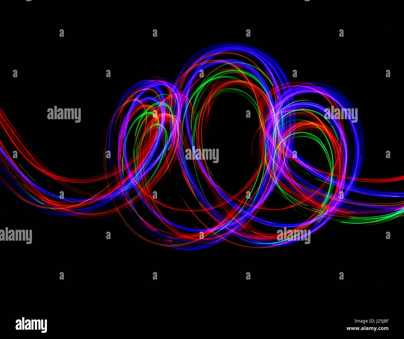 Long exposure photograph of neon multi-colour in an abstract pattern ...