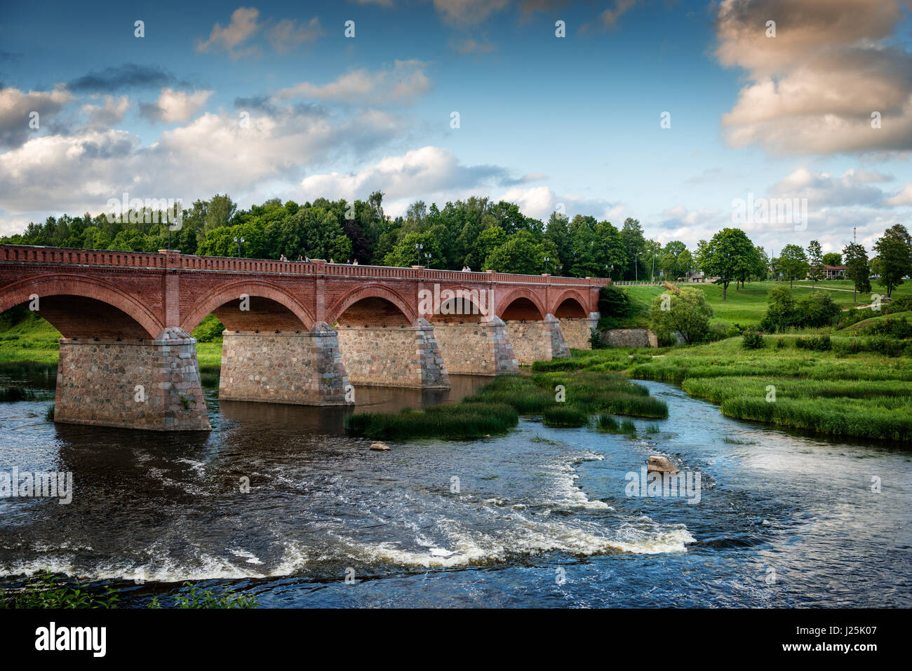Old bridge with arches over the river Stock Photo - Alamy