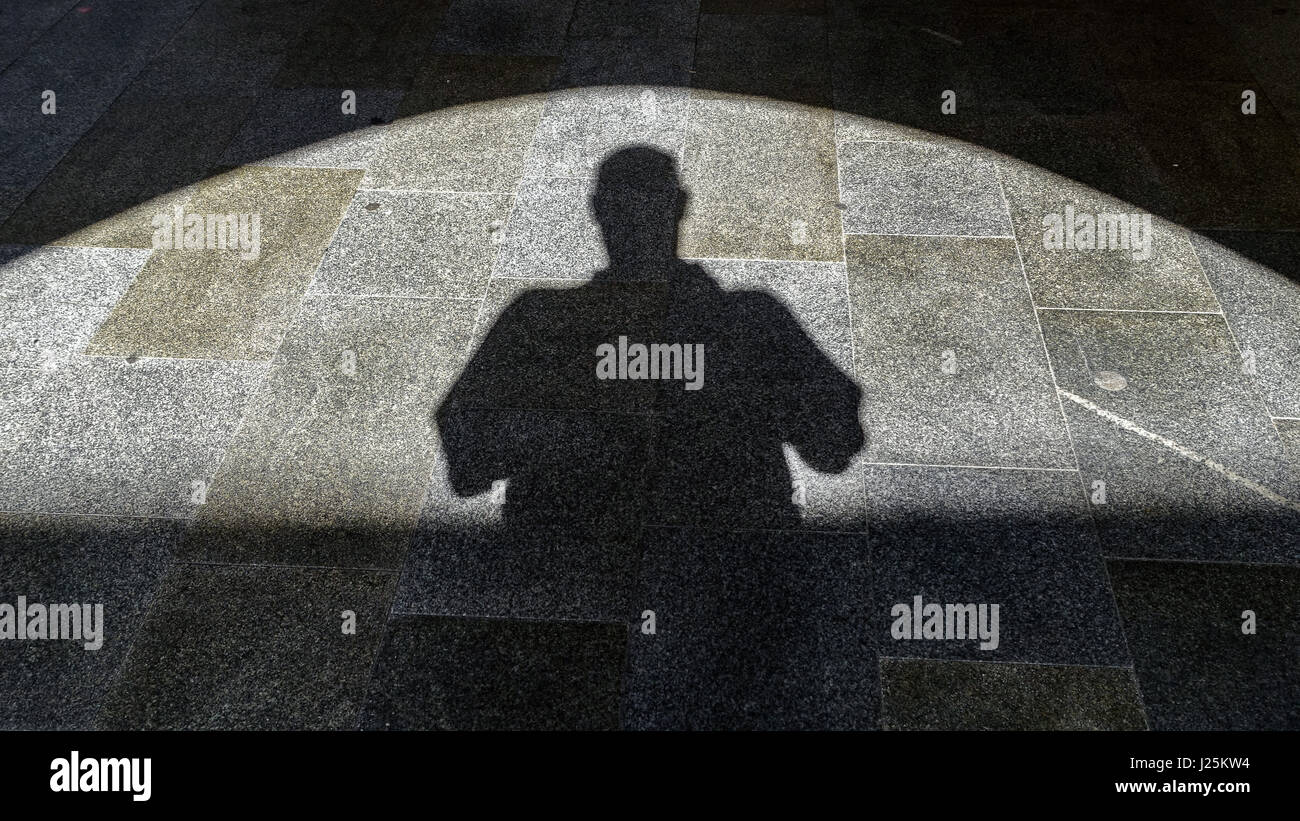 Human shadow on the pavement on a sunny day Stock Photo - Alamy