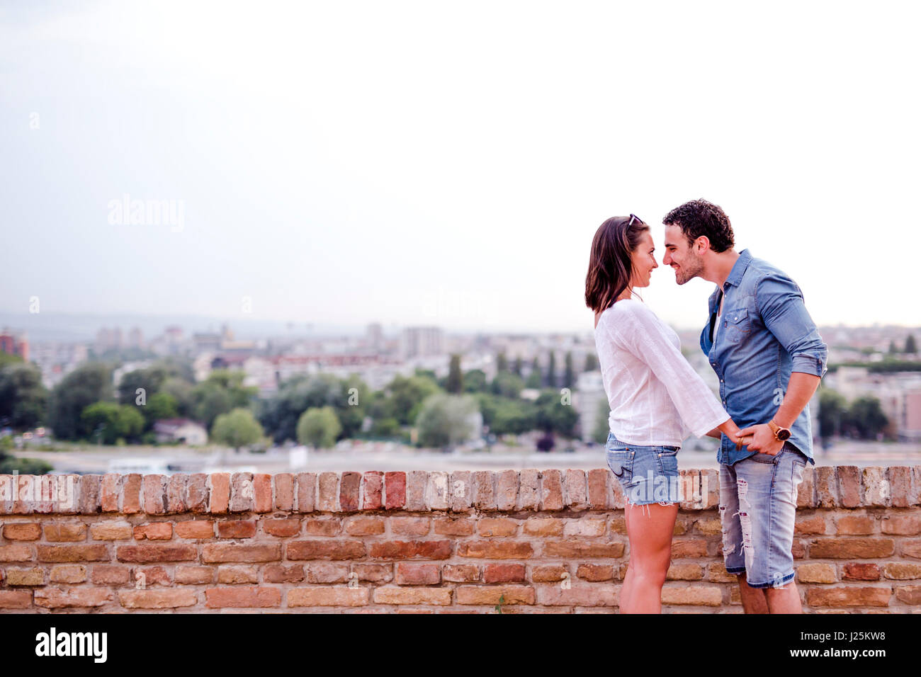Young couple holding hands close hi-res stock photography and images ...