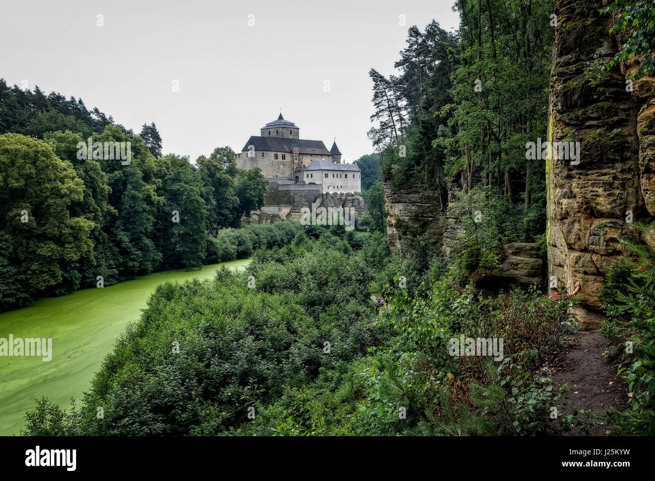Landscape with an old castle and sandstone rocks Stock Photo - Alamy