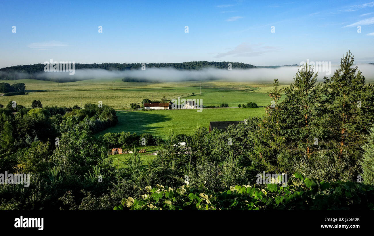 Landscape with morning fog, plains and mountains Stock Photo - Alamy