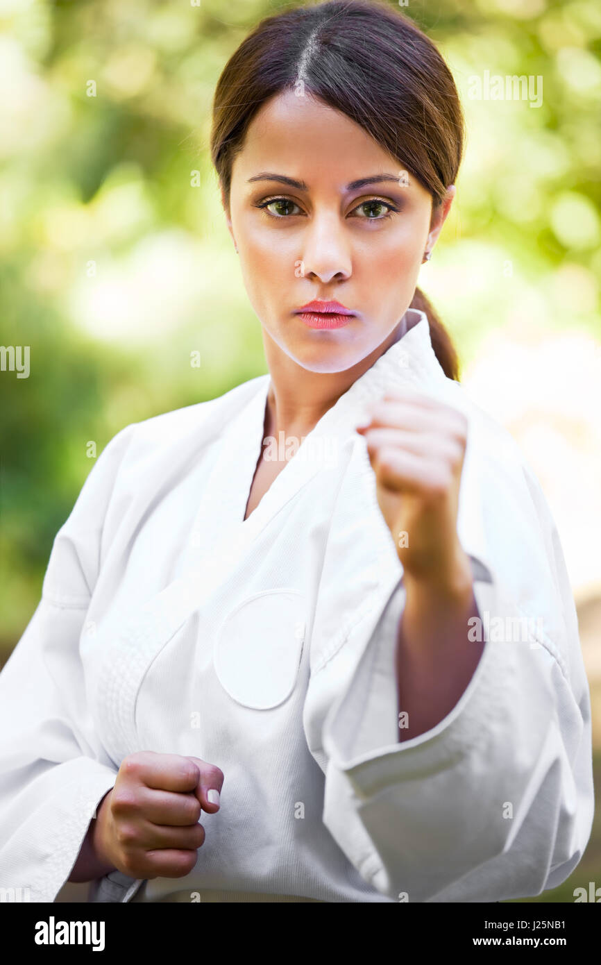 A shot of an asian woman practicing karate Stock Photo - Alamy