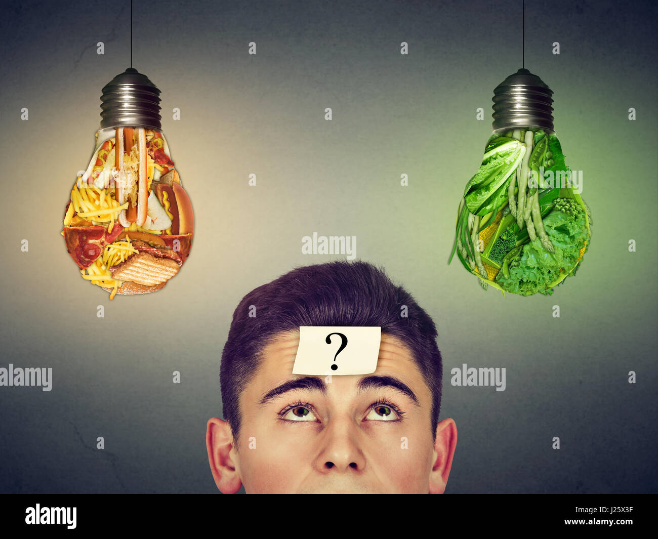 man with question mark on forehead thinking looking up at junk food and ...