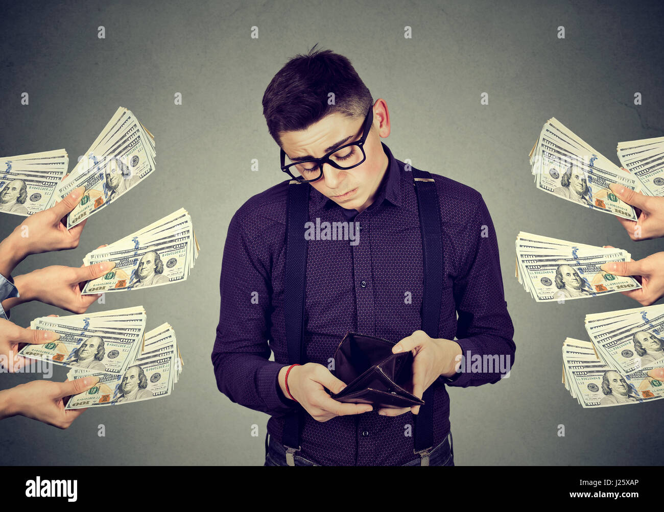 Sad desperate man with empty wallet being offered money dollar ...