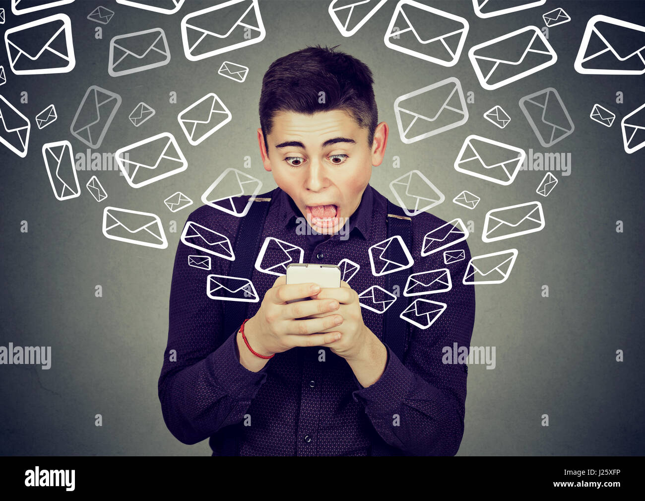 shocked man busy sending receiving messages from smart phone email ...