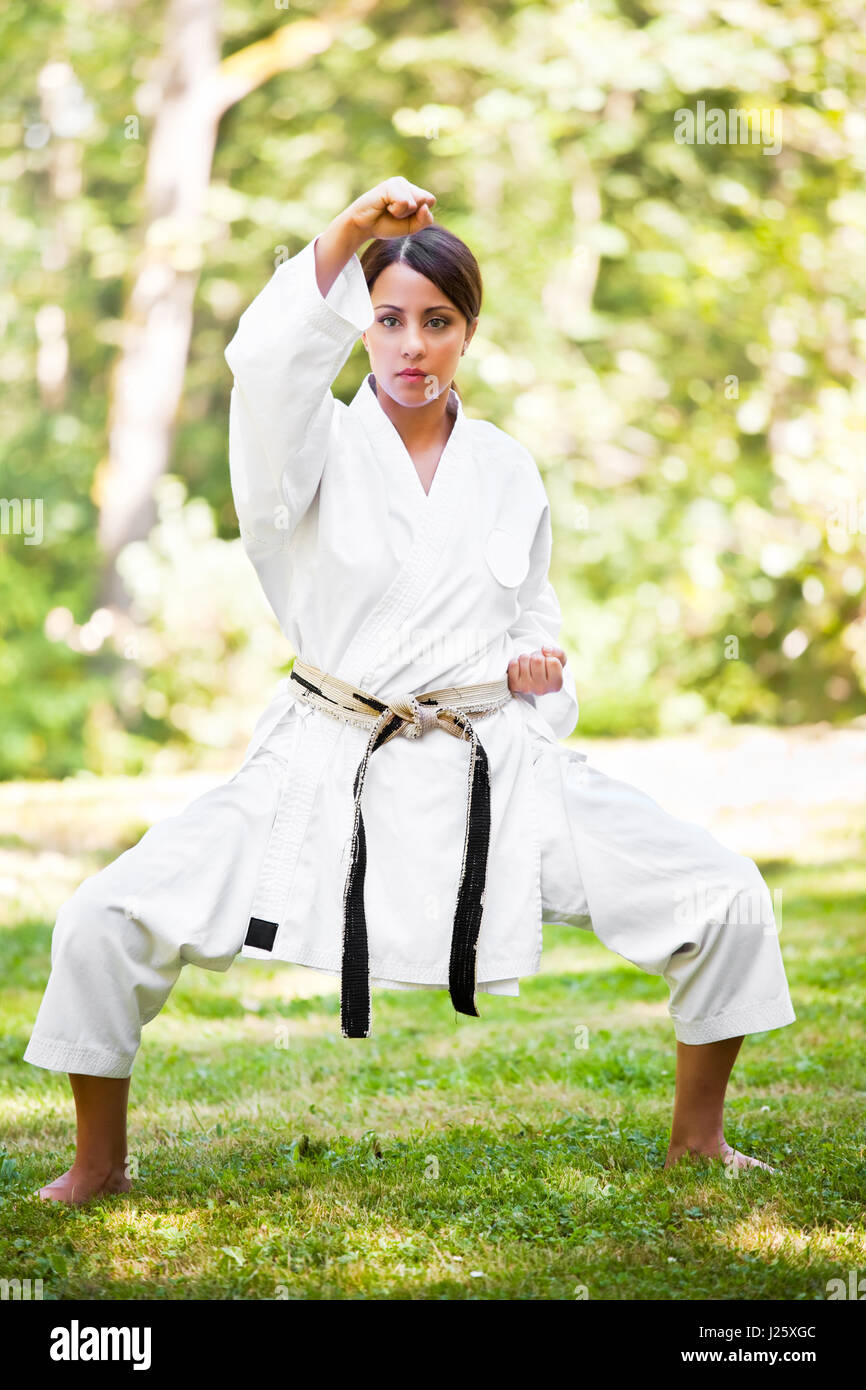 A shot of an asian woman practicing karate Stock Photo - Alamy