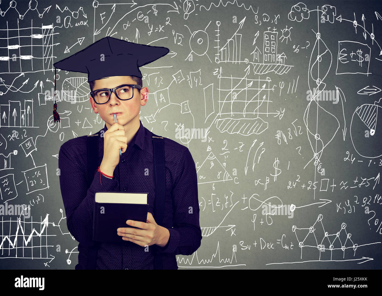 Man in graduation cap with book thinking about education, work life ...
