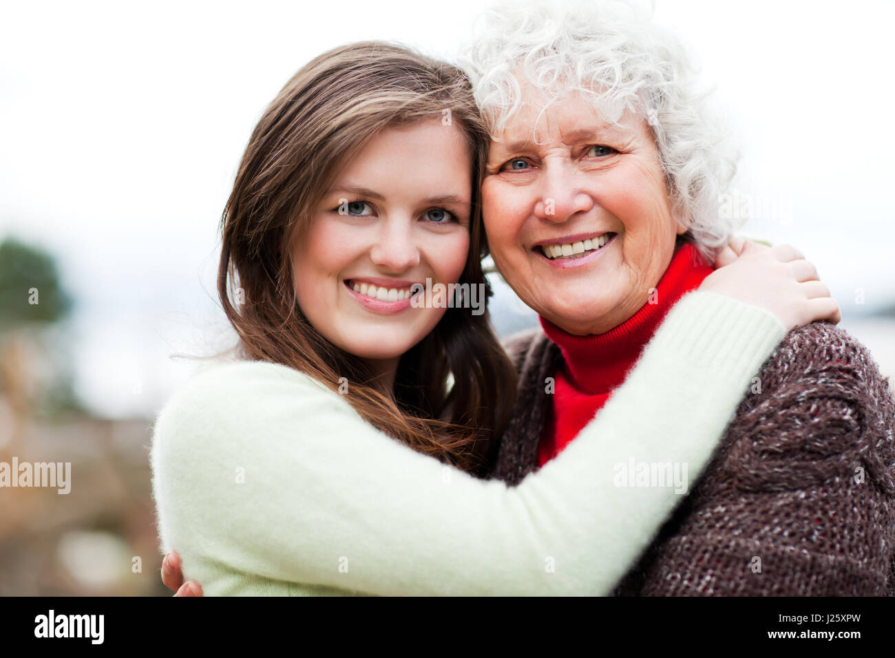 A portrait of a happy teen granddaughter with her grandmother Stock ...