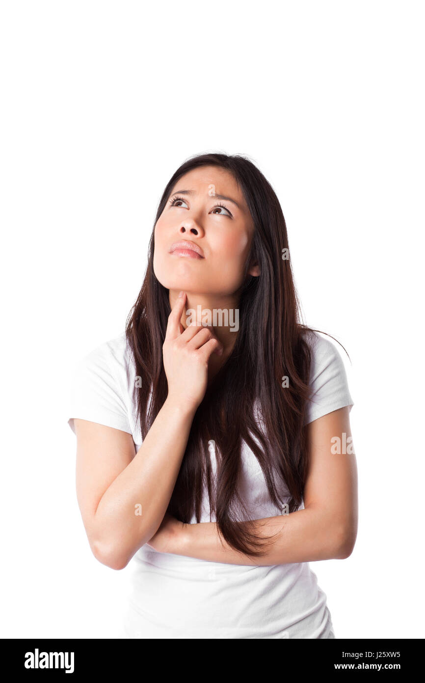An isolated shot of a beautiful asian woman thinking Stock Photo - Alamy