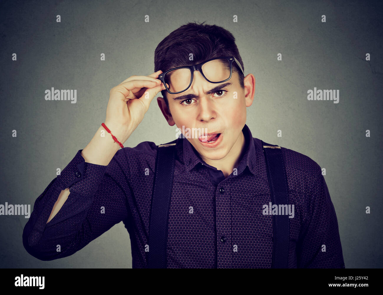 Funny looking skeptical man in glasses Stock Photo - Alamy