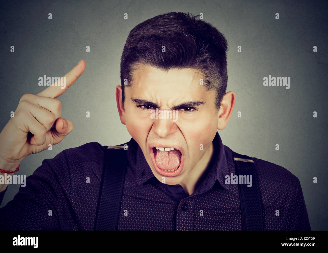 portrait of an angry young man Stock Photo - Alamy