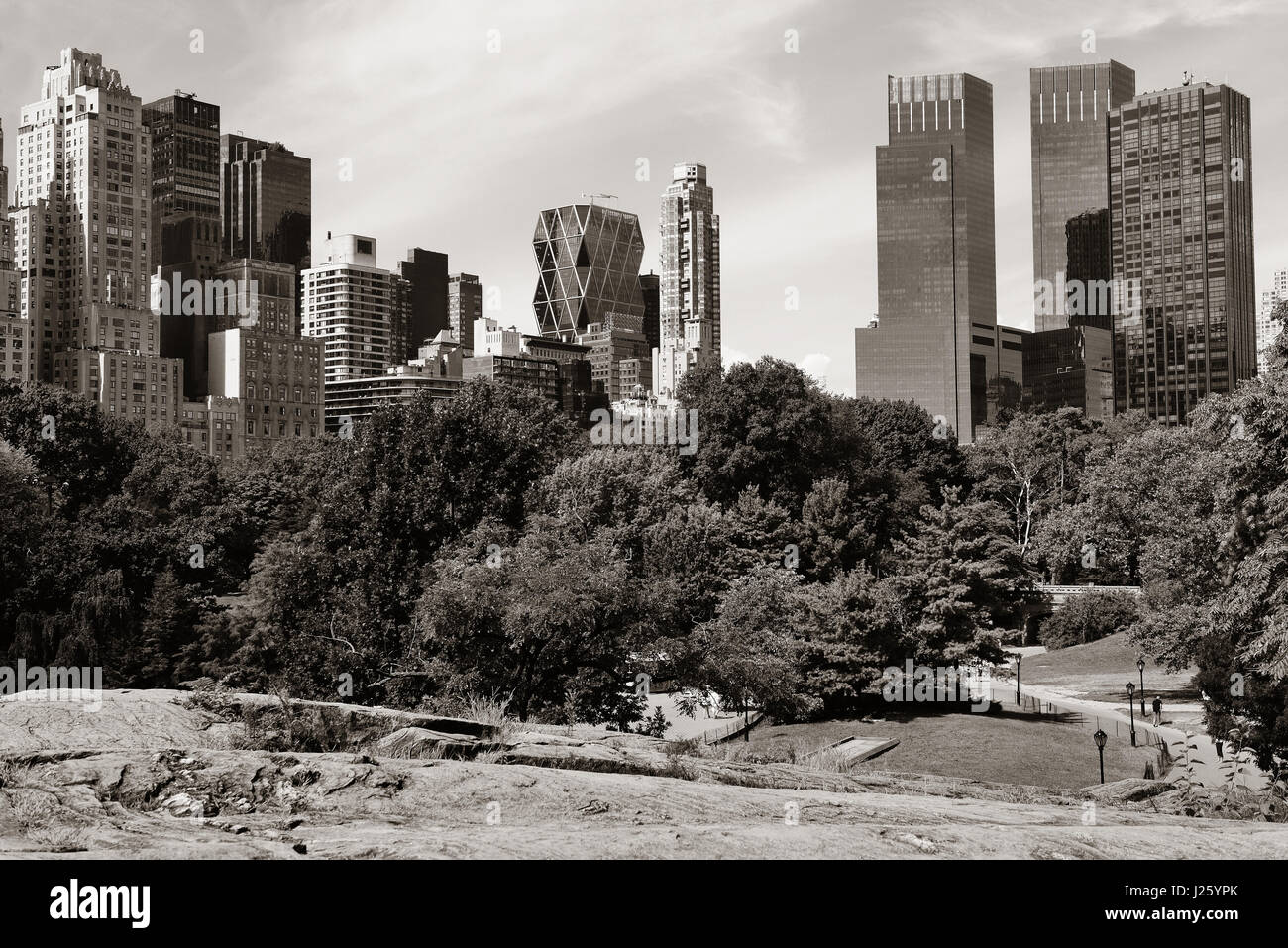 Central Park Spring with skyline in midtown Manhattan New York City ...