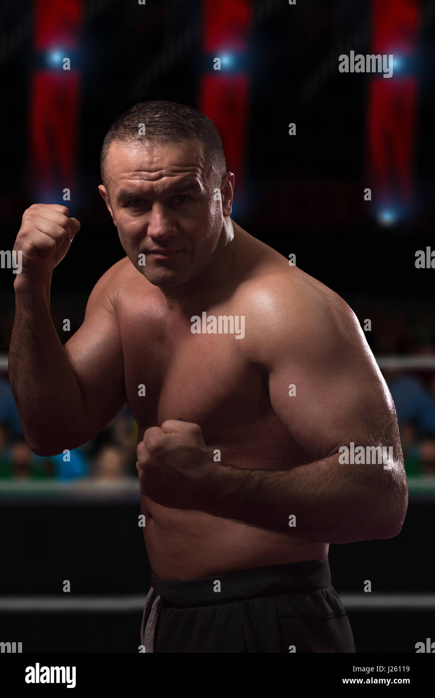 professional kickboxer with hands in martial arts position training for ...