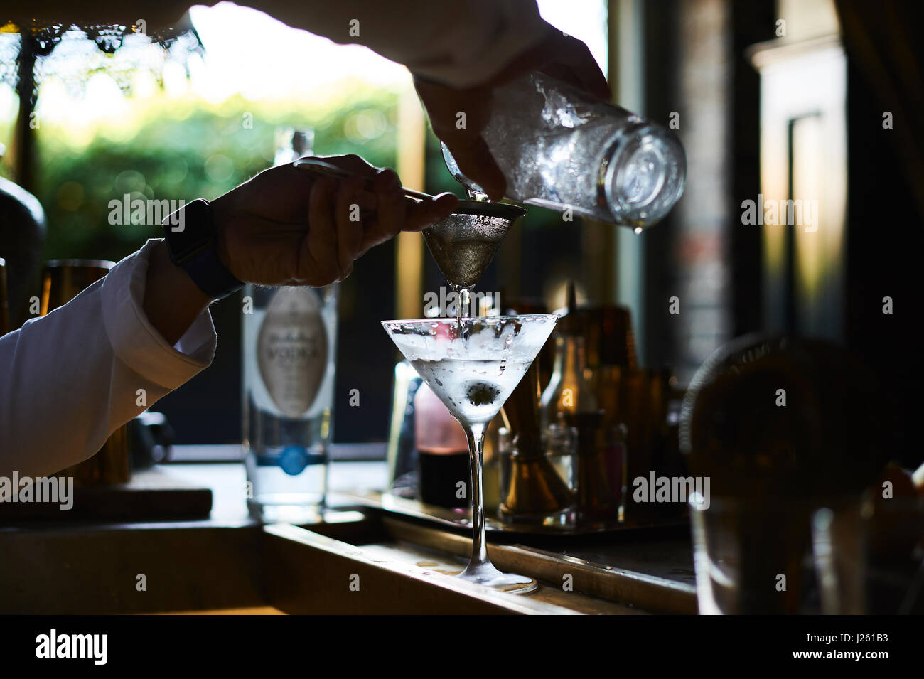 Mixologist crafting cocktails at bar stella in Los Angeles, CA Stock Photo - Alamy