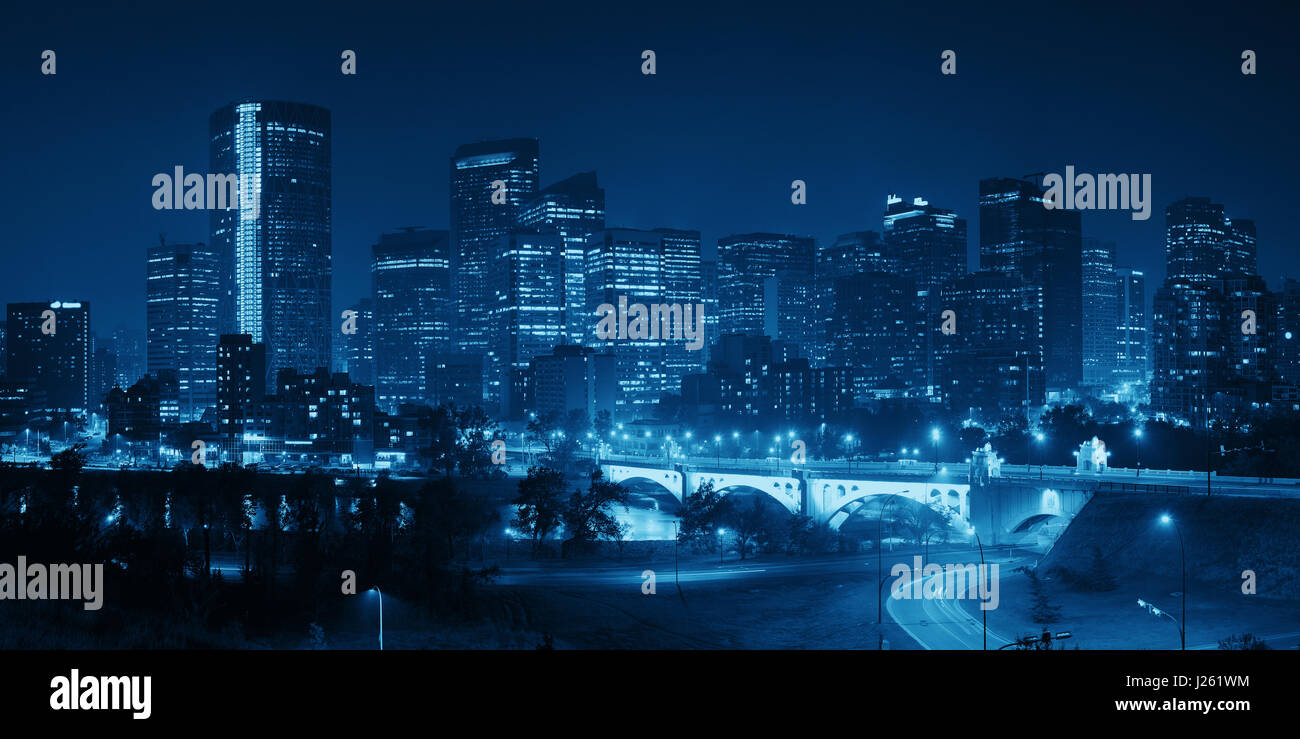 Calgary downtown cityscape with skyscraper and bridge at night, Canada ...