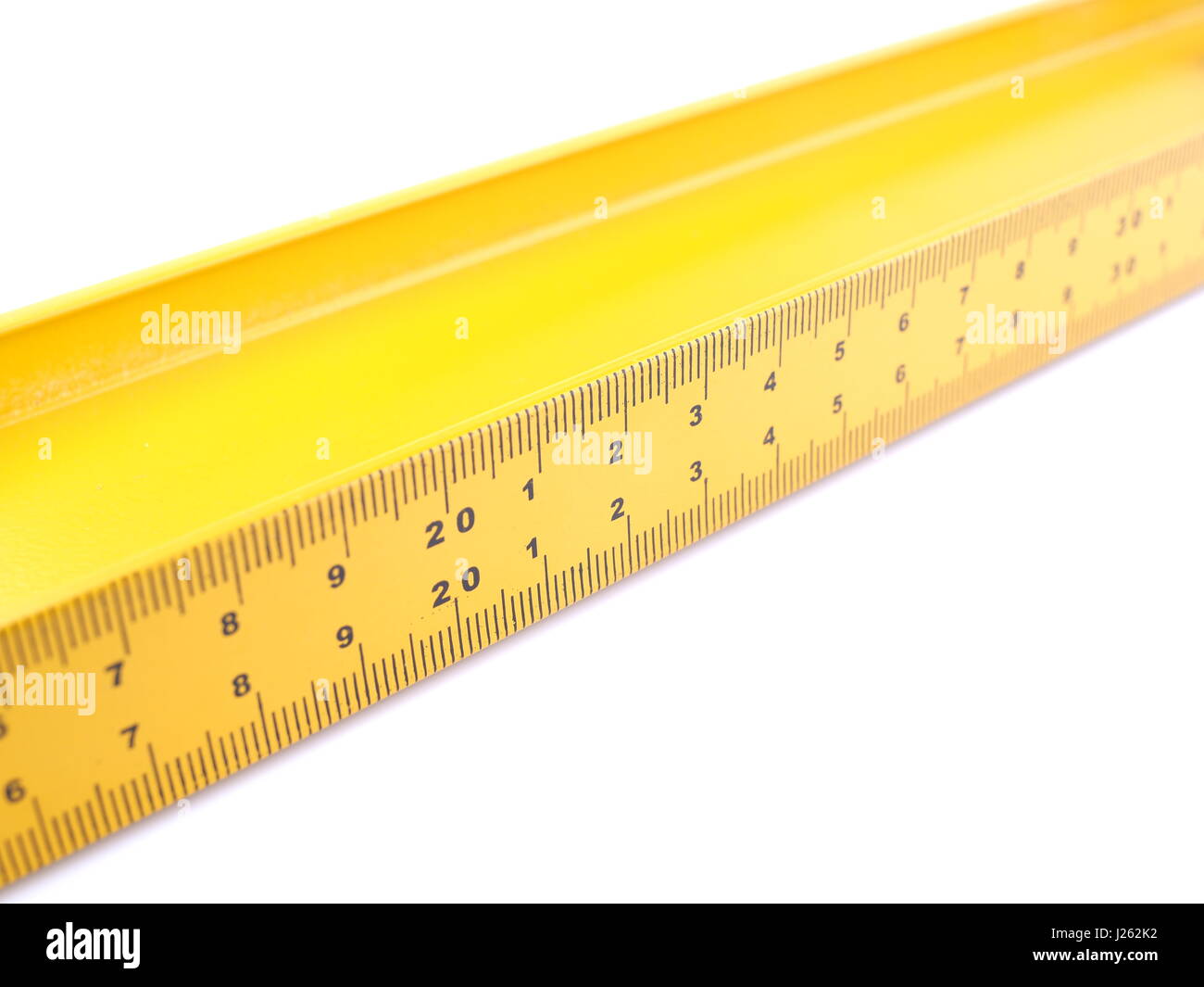 Yellow level on a white background Stock Photo - Alamy