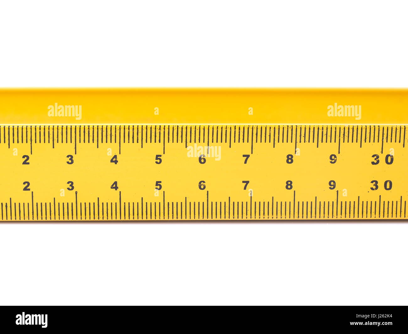 Yellow level on a white background Stock Photo - Alamy