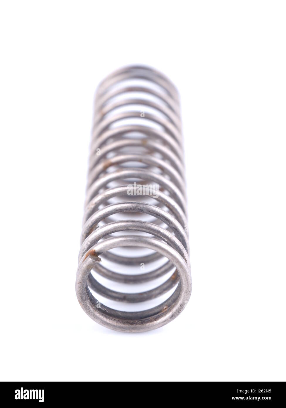 Metal spring on a white background Stock Photo - Alamy