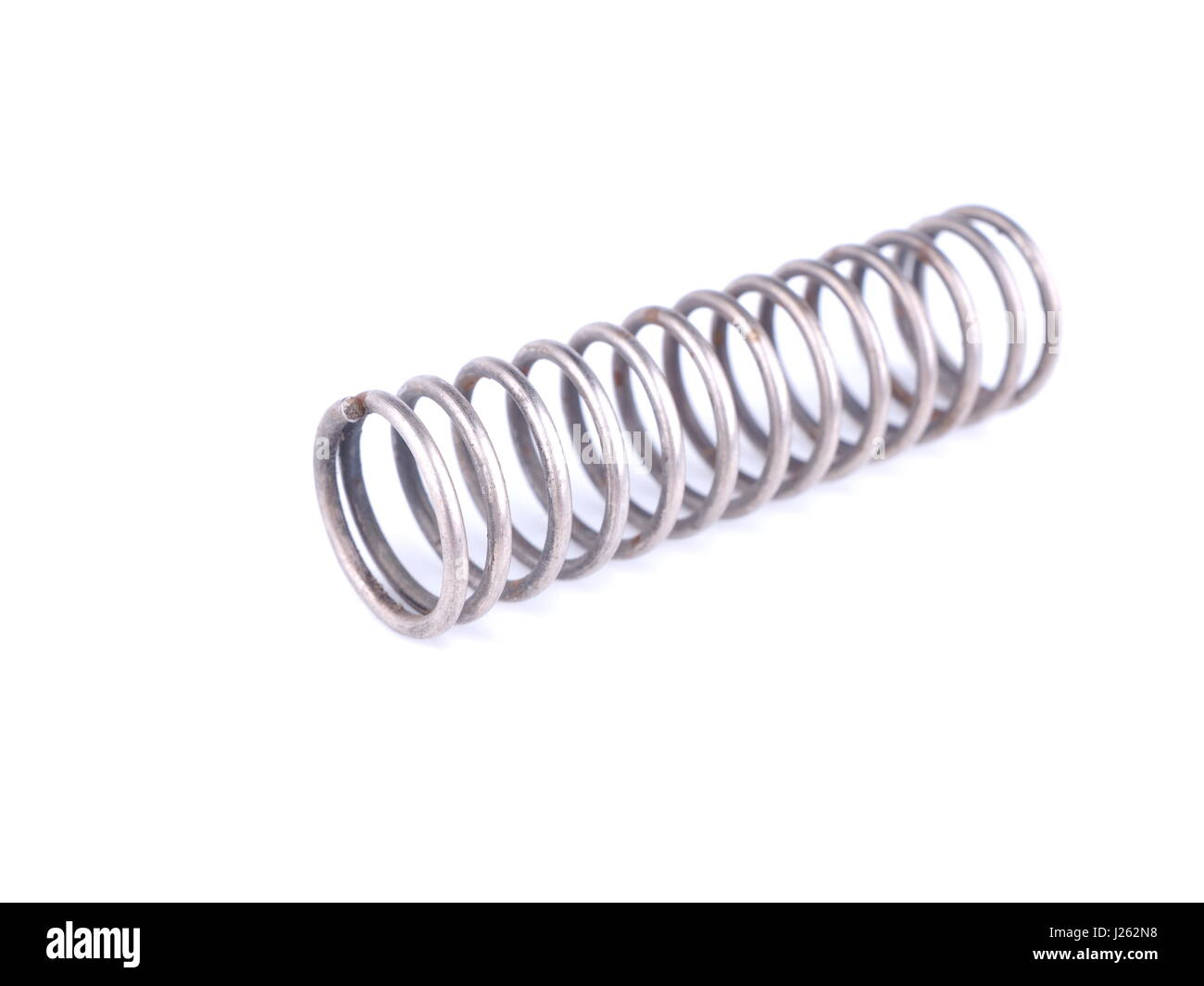Metal spring on a white background Stock Photo - Alamy