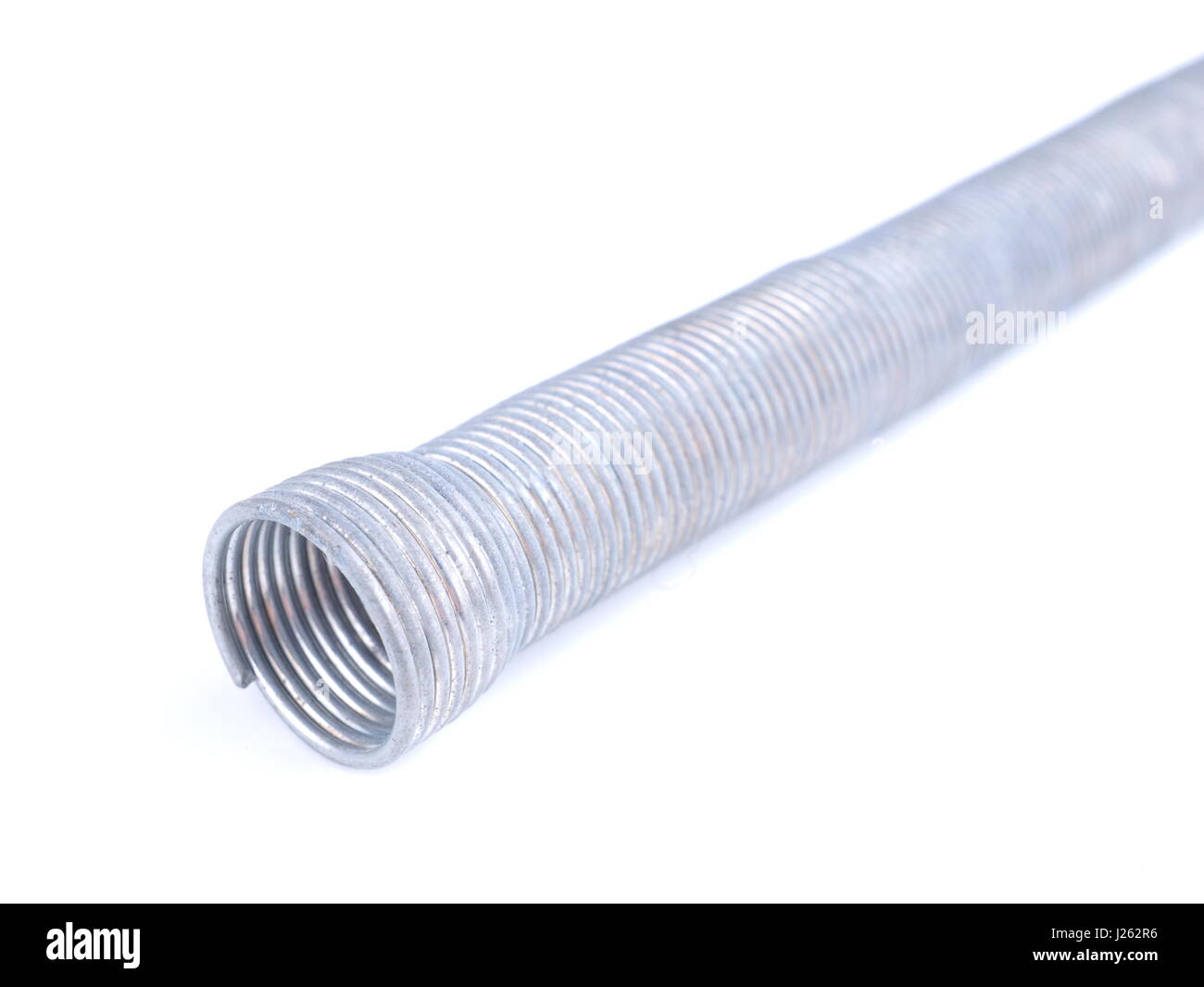 Metal spring on a white background Stock Photo - Alamy
