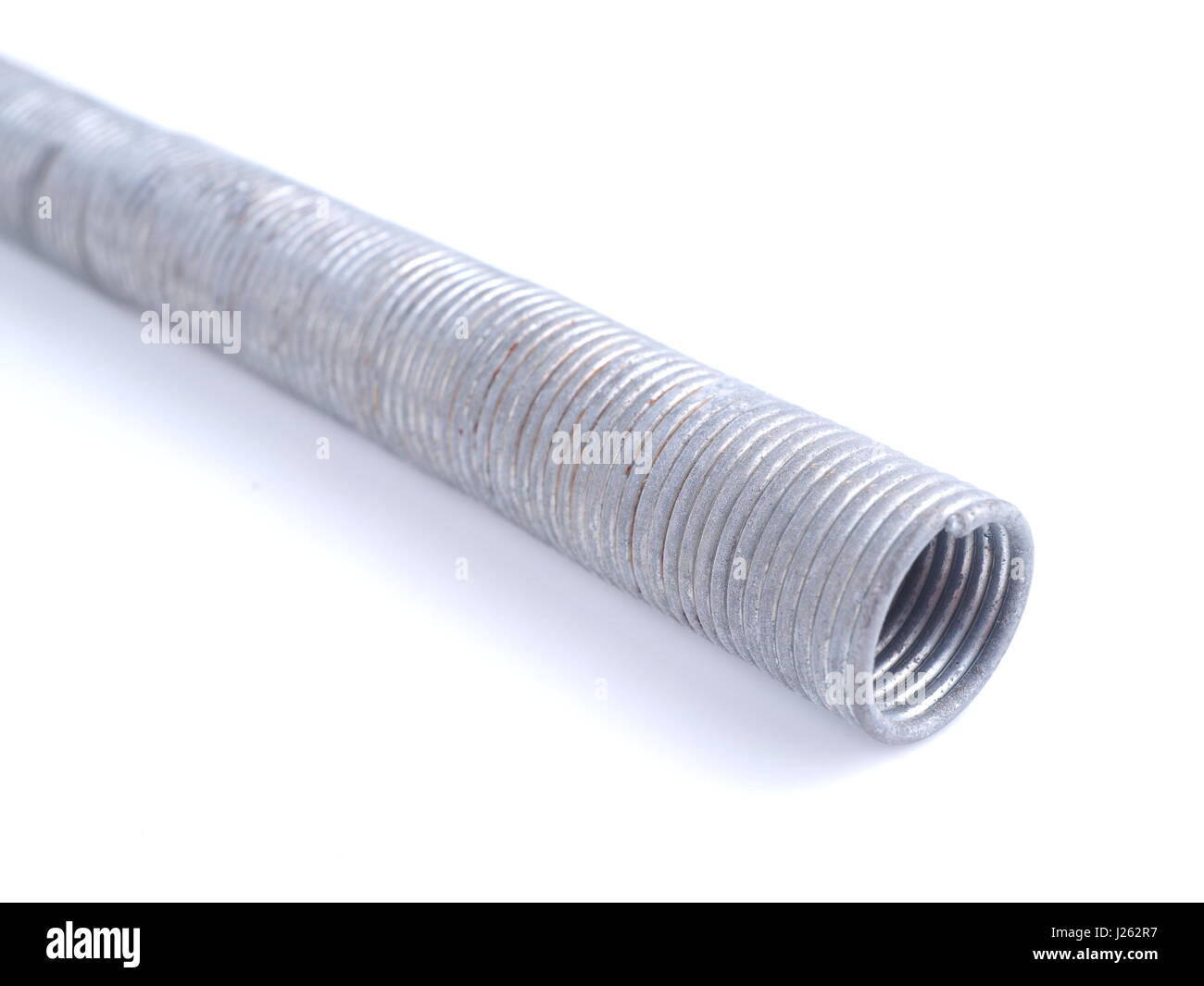 Metal spring on a white background Stock Photo - Alamy