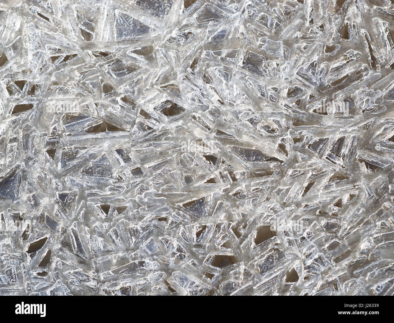Ice in a puddle. background Stock Photo - Alamy