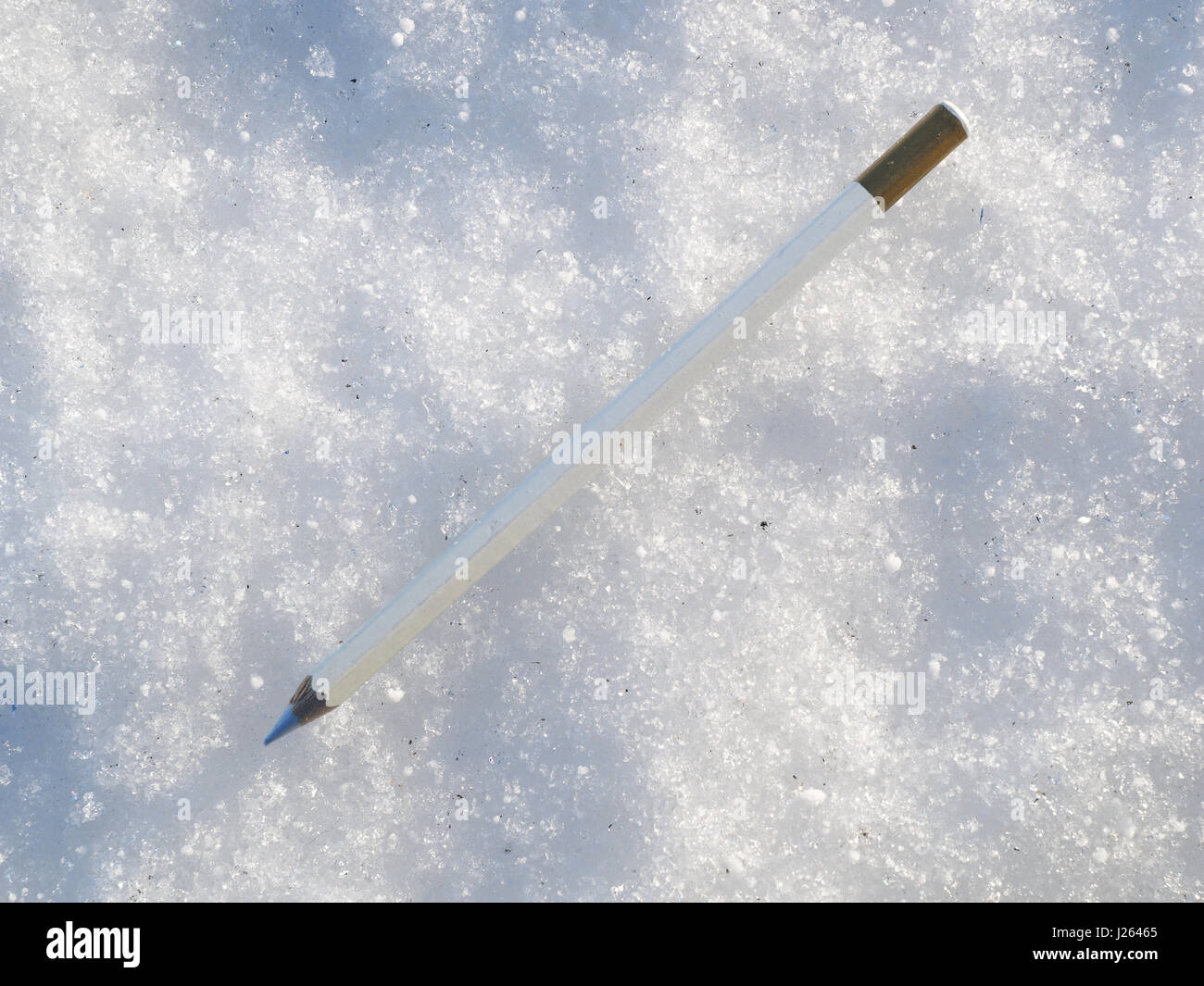 Pencil in the snow Stock Photo - Alamy