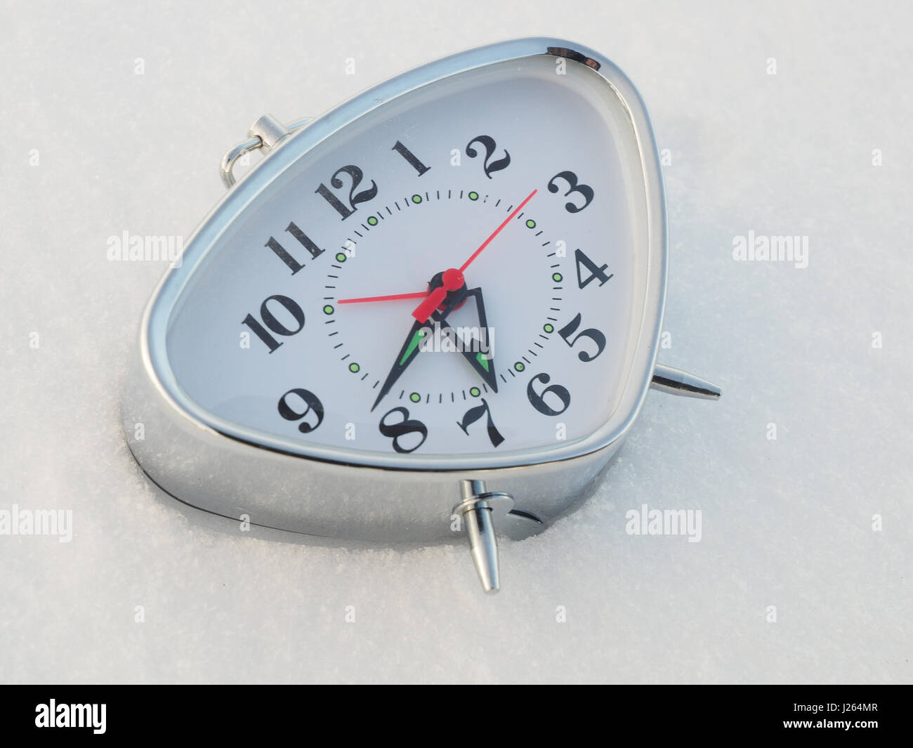 clock in the snow Stock Photo - Alamy