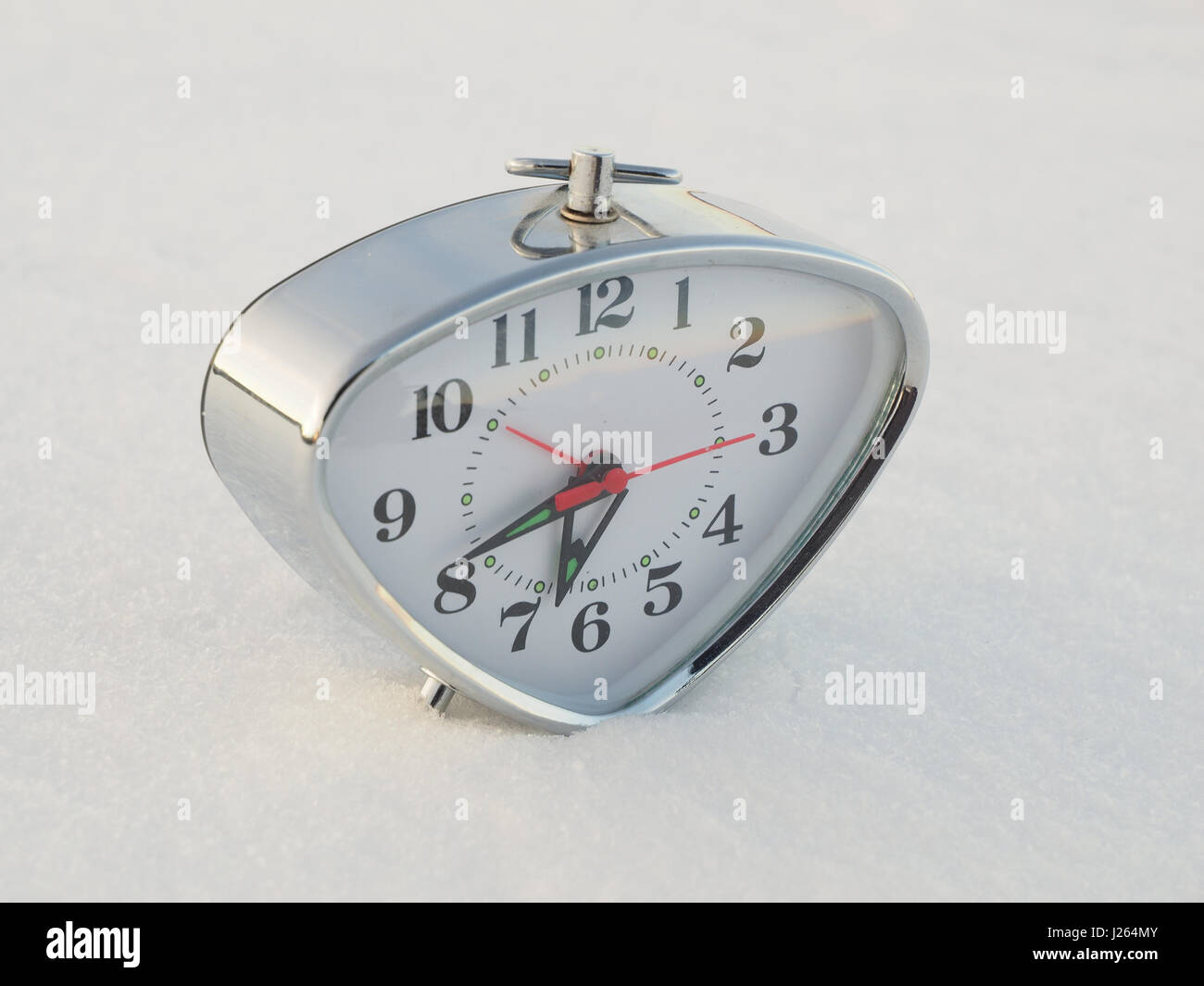 clock in the snow Stock Photo - Alamy