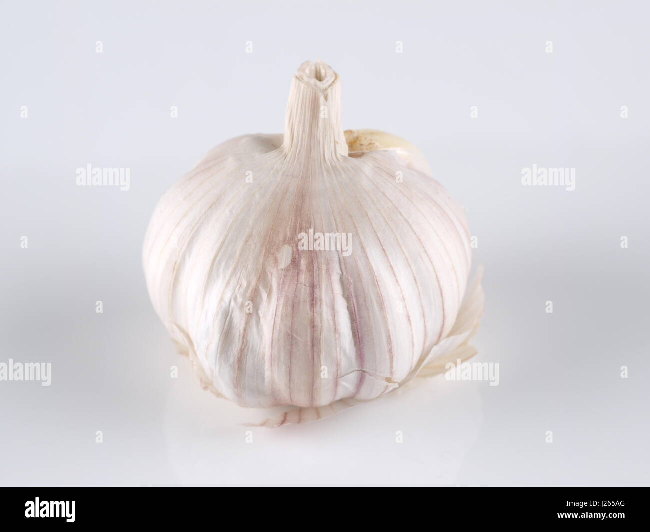 garlic on a light background Stock Photo - Alamy