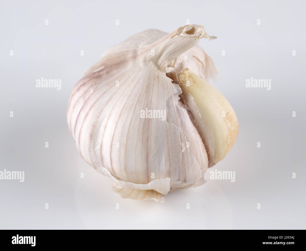 garlic on a light background Stock Photo - Alamy