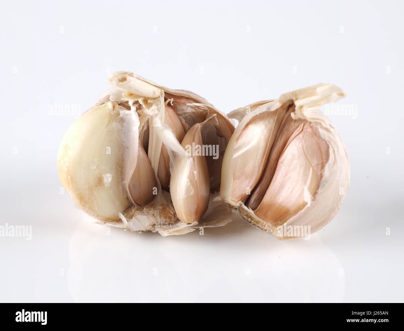 garlic on a light background Stock Photo - Alamy