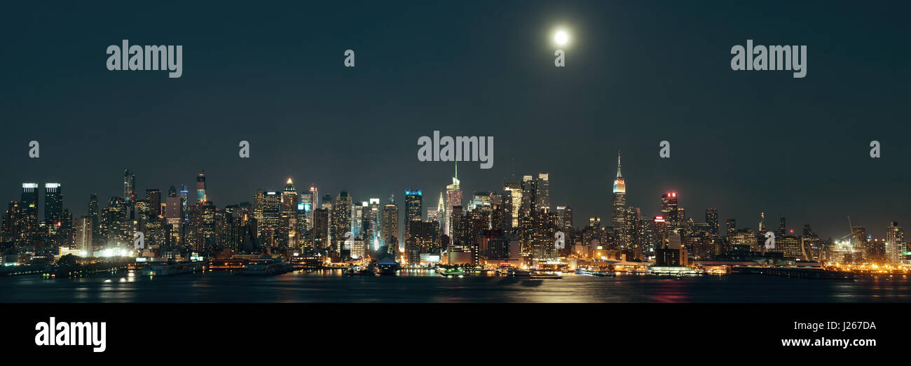 Moon rise over midtown Manhattan with city skyline at night Stock Photo ...