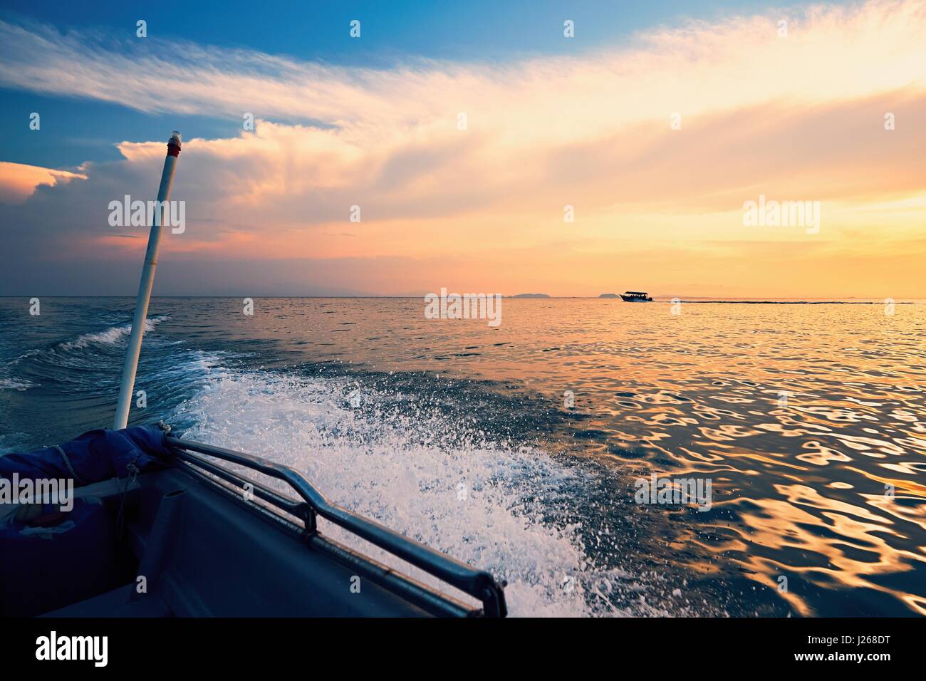 Adventure on the sea. Trip by motorboat during amazing sunset Stock ...