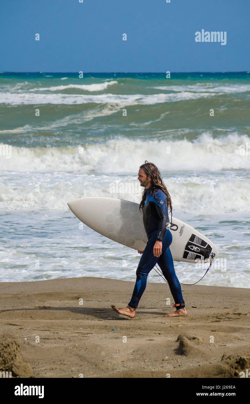 Surfer walking with surfboard along the beach, Andalusia, Spain Stock ...