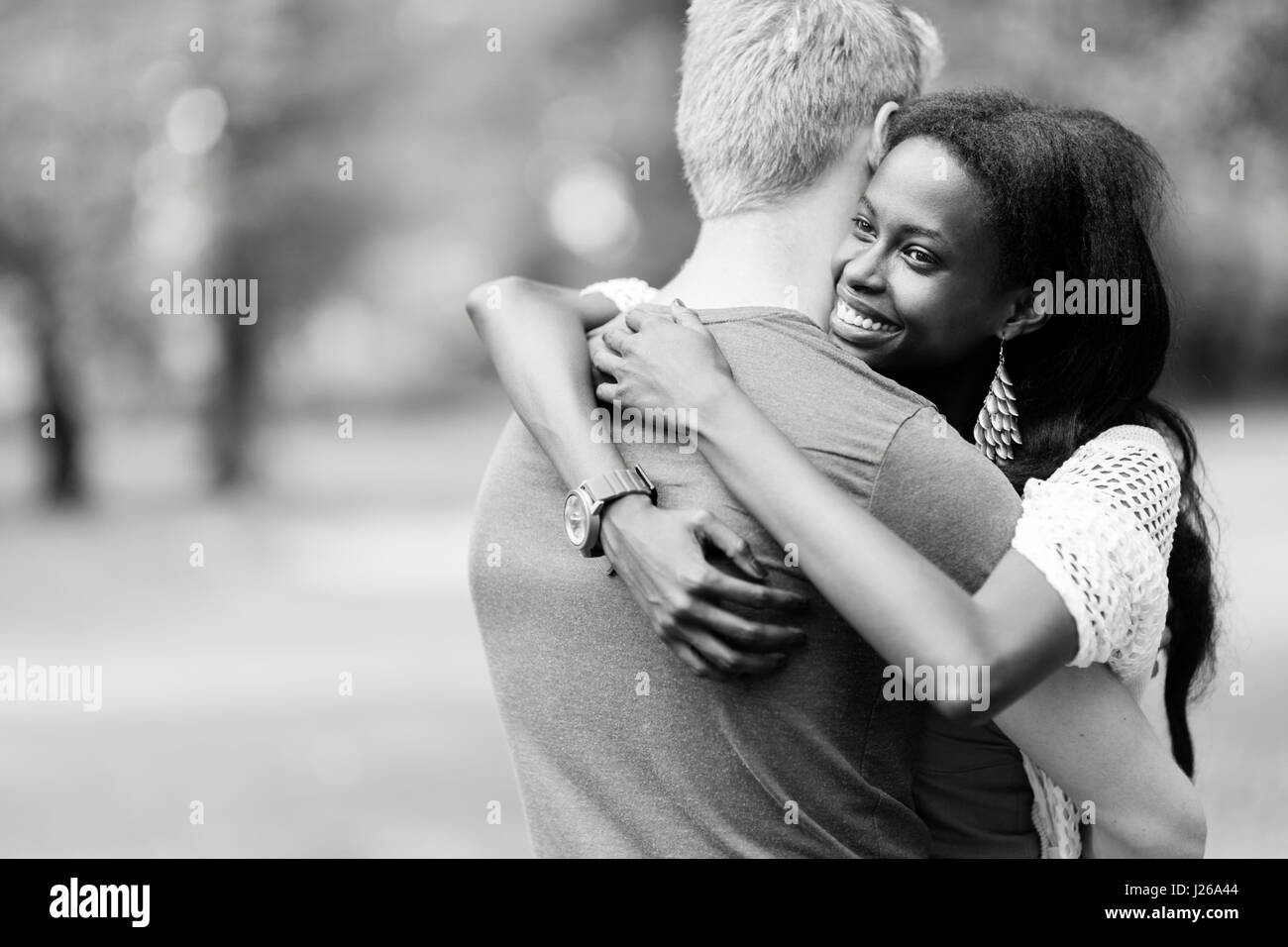 Couple in love hugging peacfully outdoors and being truly happy ...