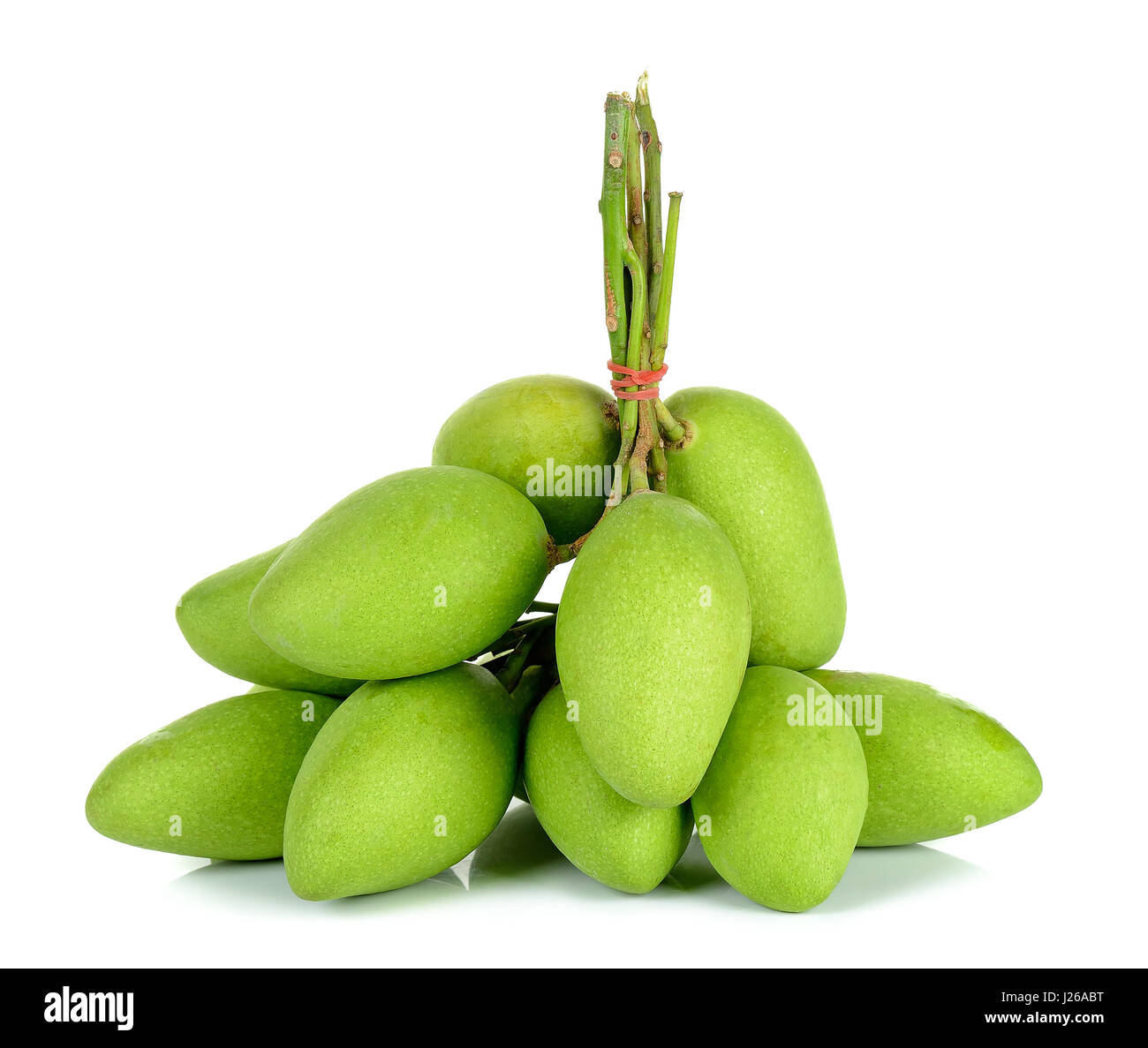 green mango isolated on a white background Stock Photo - Alamy