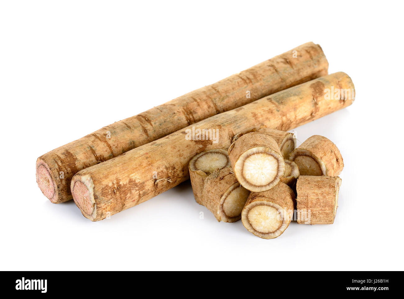 Burdock roots isolated on the white background Stock Photo - Alamy