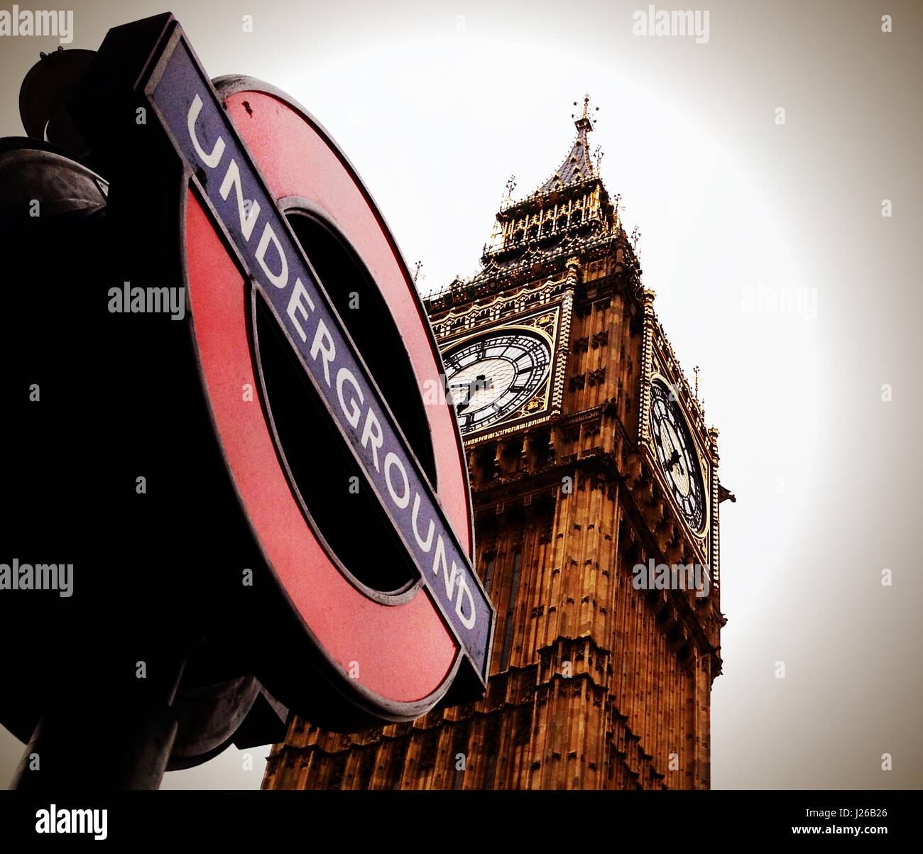 Low-angle view of Big Ben and Underground sign, London, England, UK ...