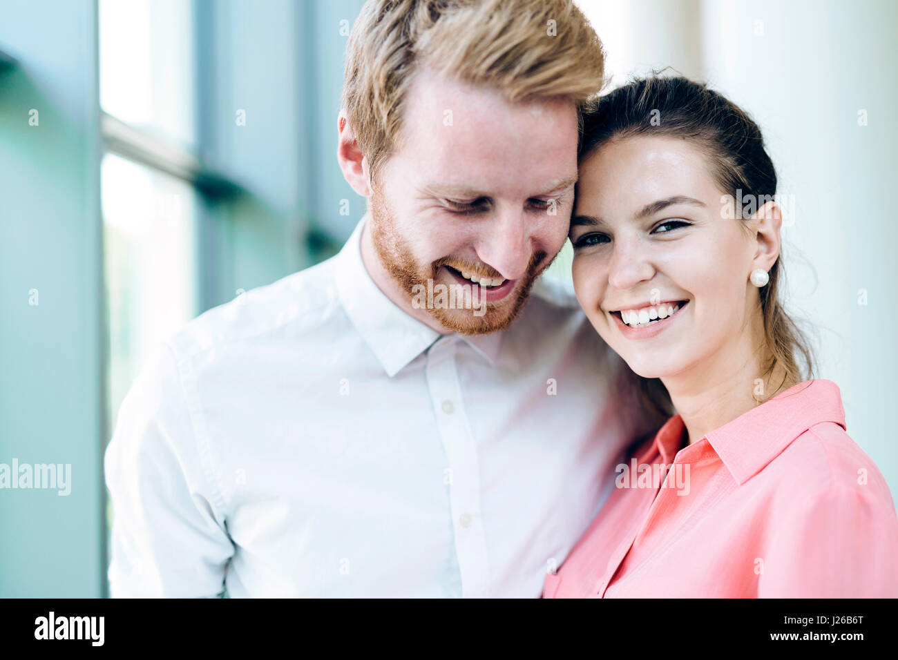 Beautiful colleagues in business smiling and being close to each other ...