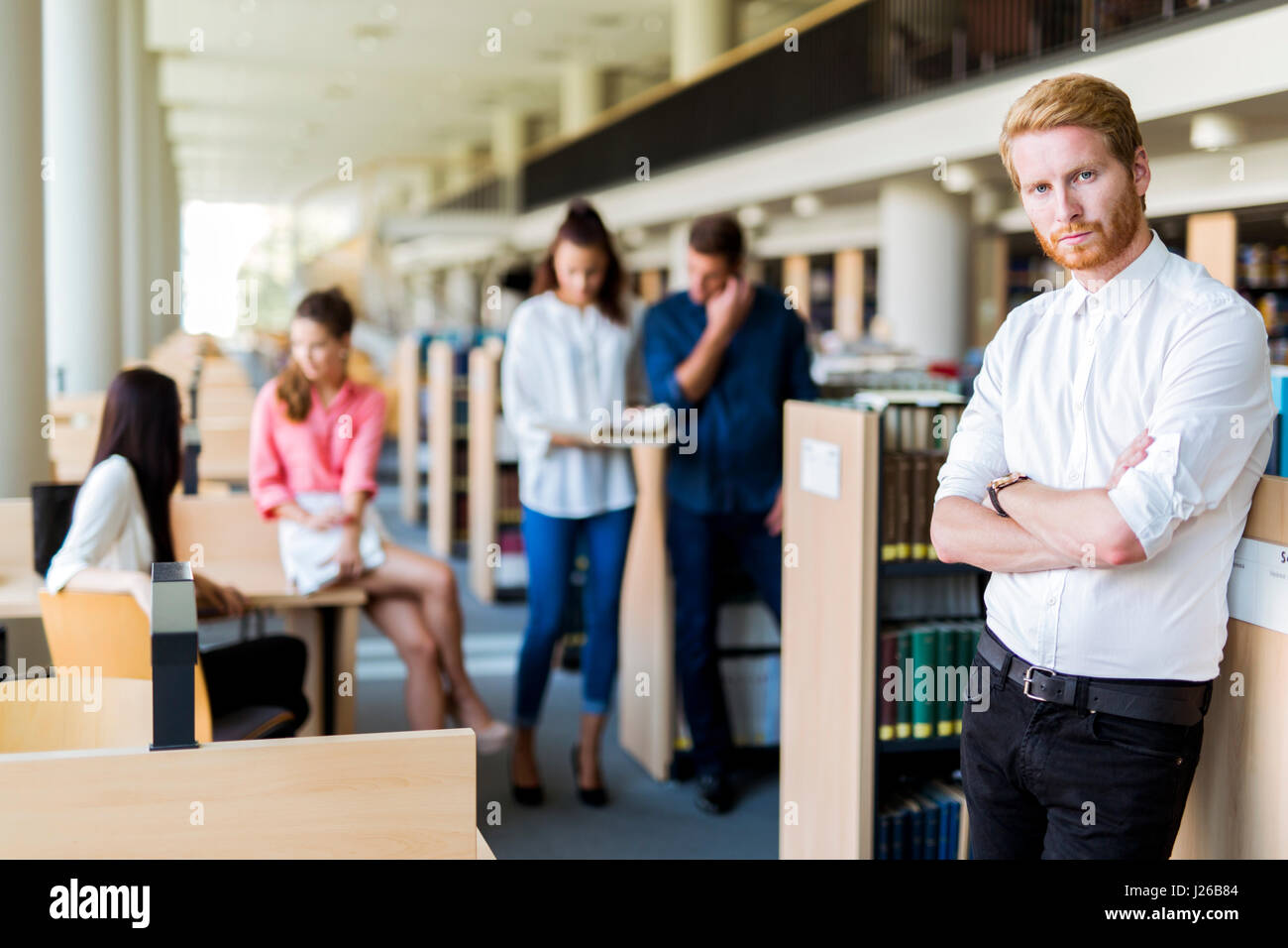 Group of smart young people educating themselves in a library Stock ...