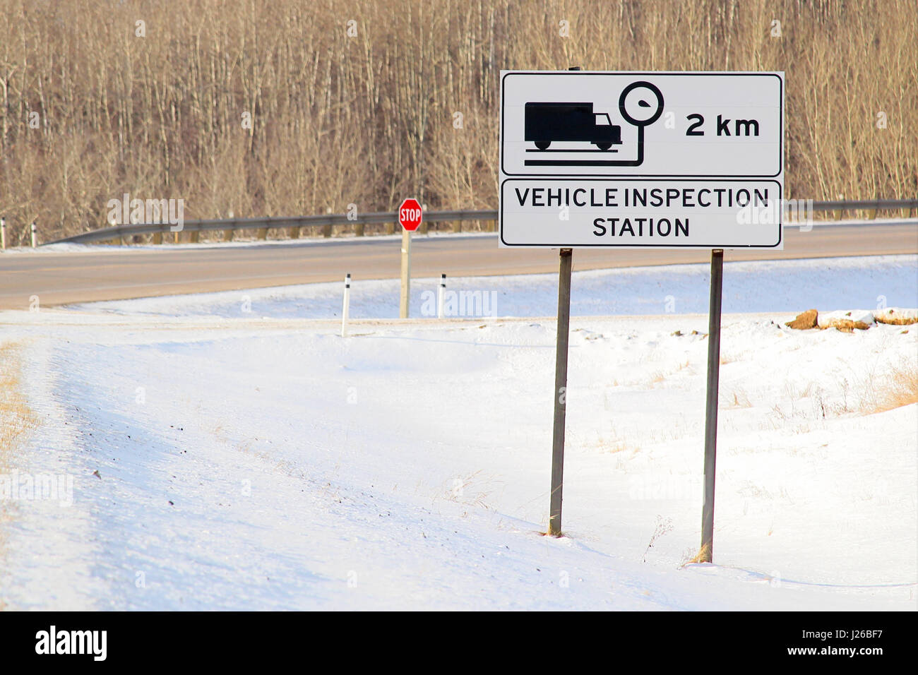 Vehicle Inspection Ahead Sign with Highway in the Background Stock ...