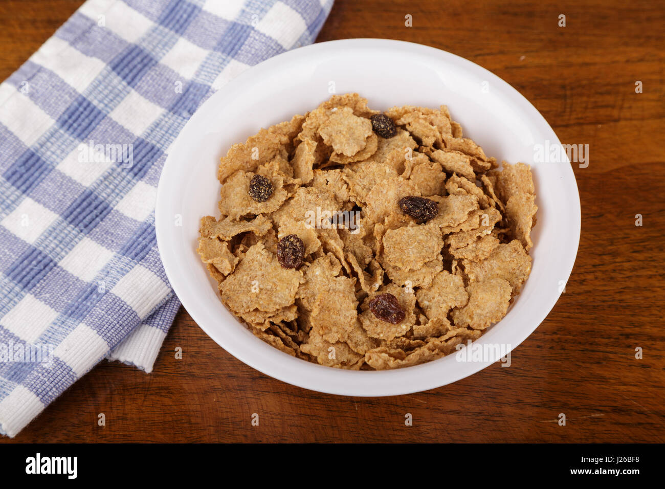 A bowl of wheat bran cereal with raisin Stock Photo - Alamy