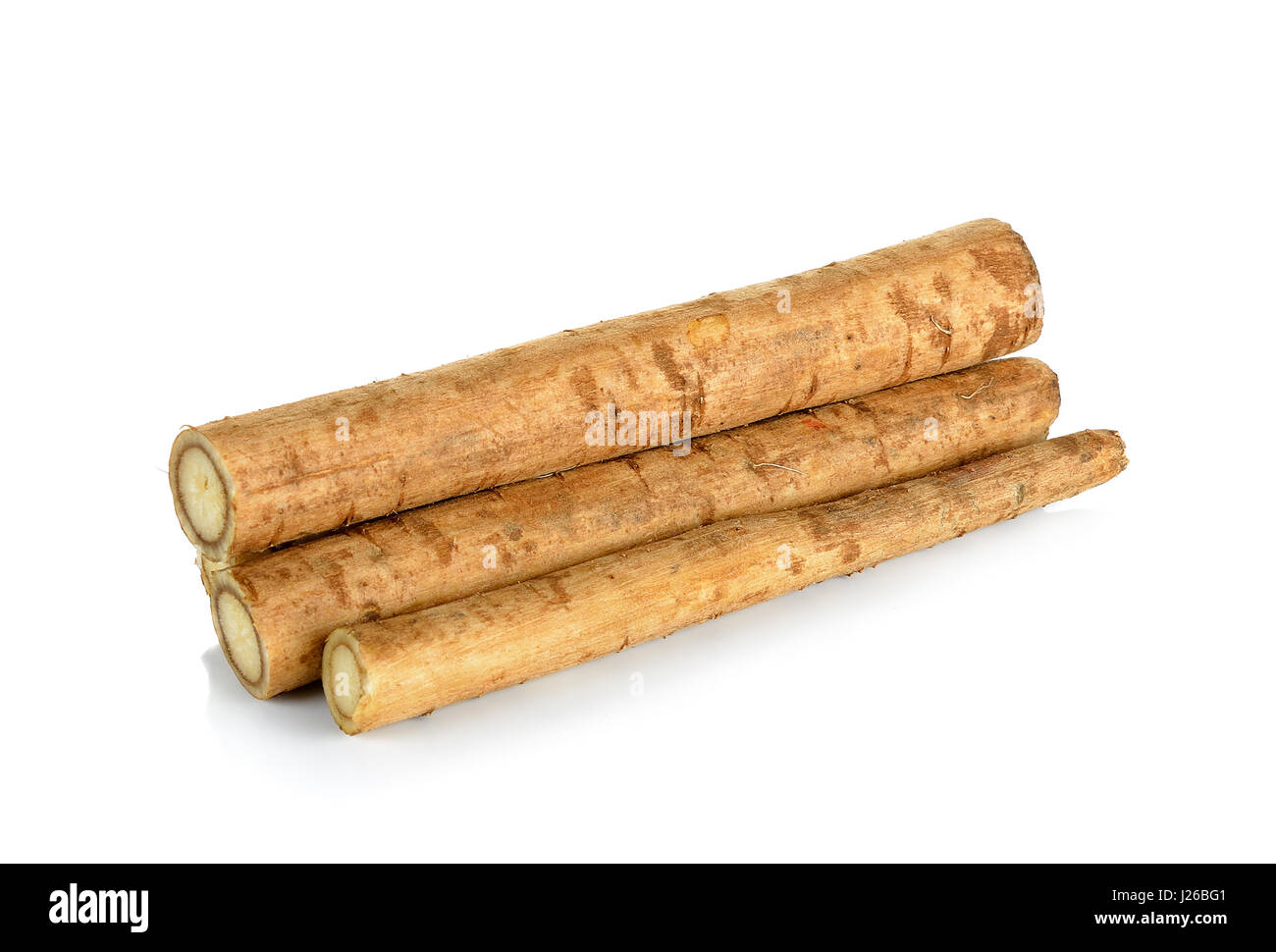 Burdock roots isolated on the white background Stock Photo - Alamy