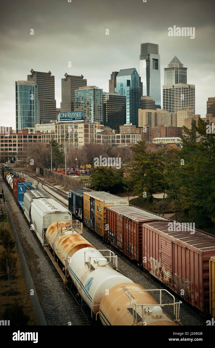PHILADELPHIA, PENNSYLVANIA - MAR 26: city skyline with cargo train on ...